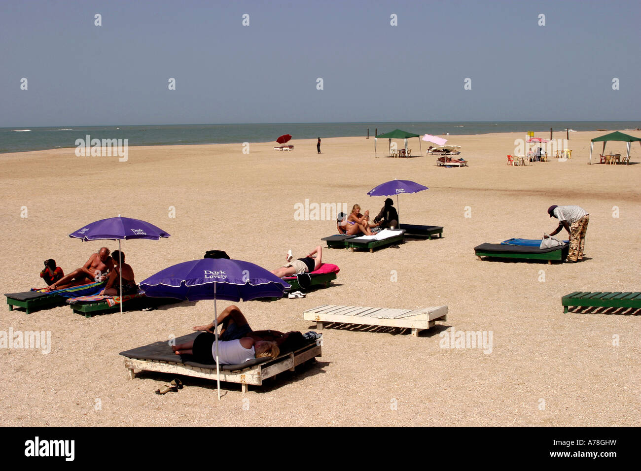 The Gambia Kololi beach tourists on sunbeds Stock Photo - Alamy