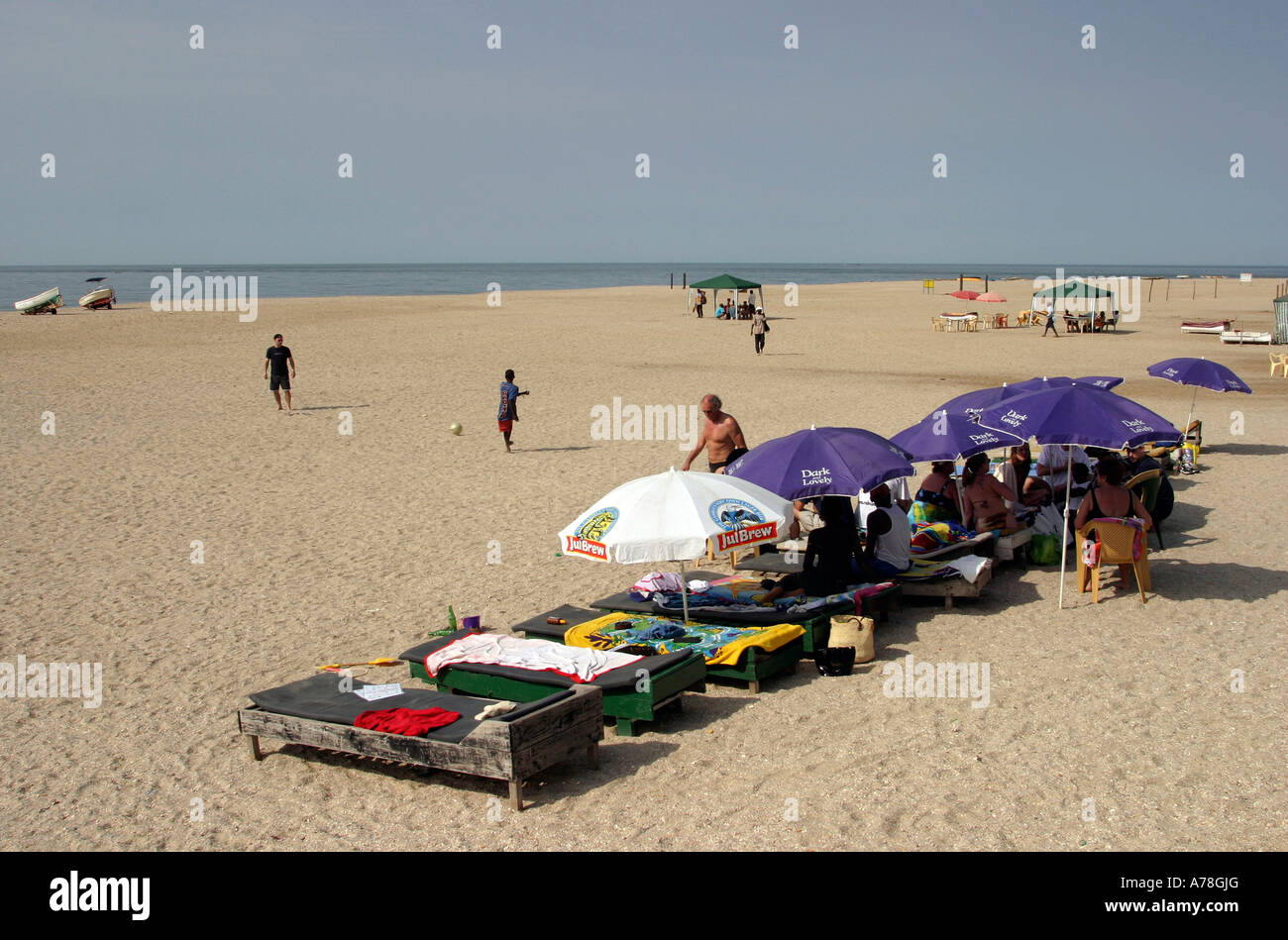 The Gambia Kololi beach tourists on sunbeds Stock Photo - Alamy