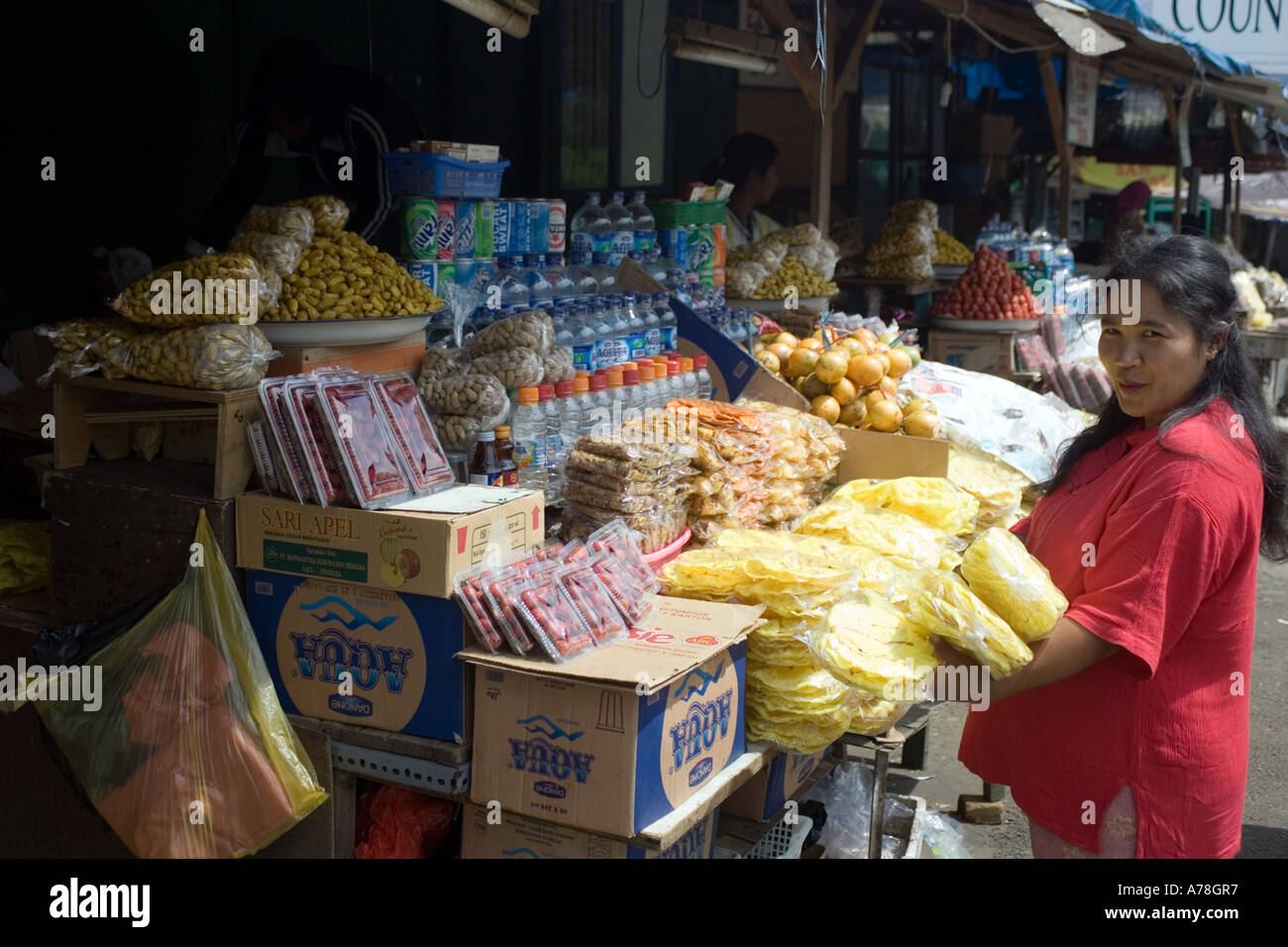Street market stall and trader Bali Indonesia Stock Photo - Alamy