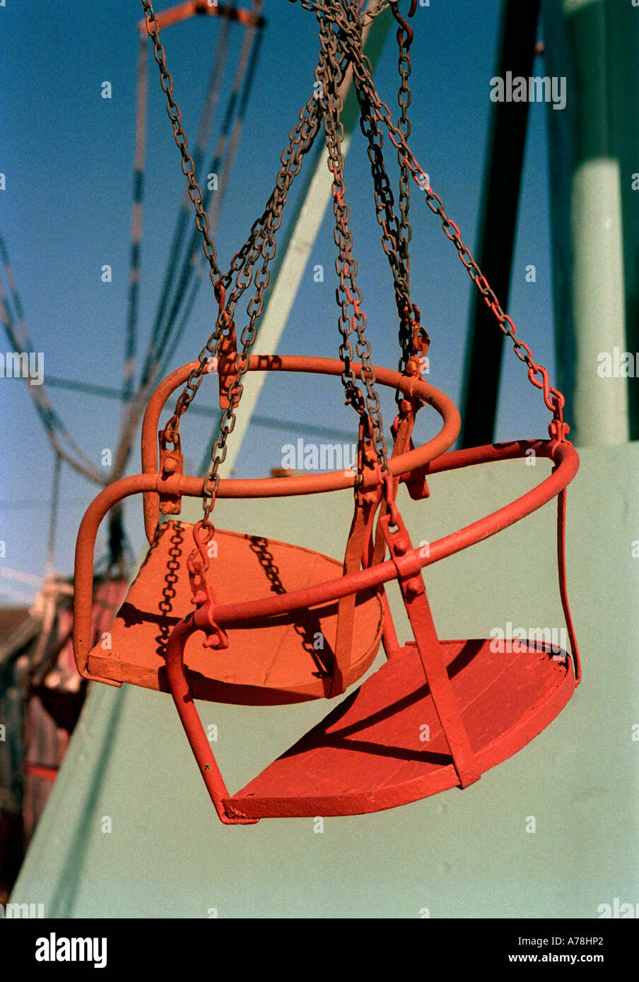 Tied up chairs of a funfair ride Stock Photo - Alamy