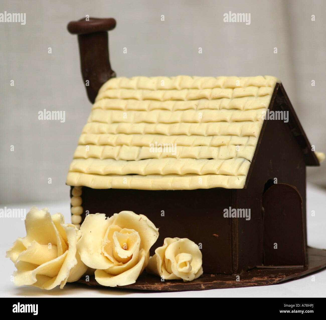 Chocolate house with flowers Stock Photo - Alamy