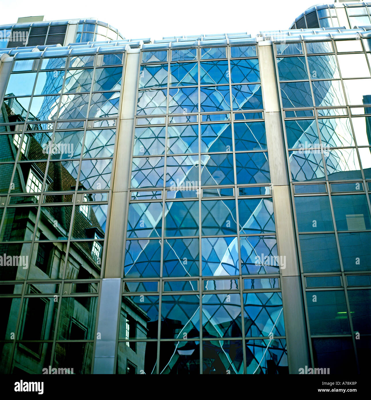 Reflection of Swiss Re Tower, gerkin, gherkin in an adjacent glass ...