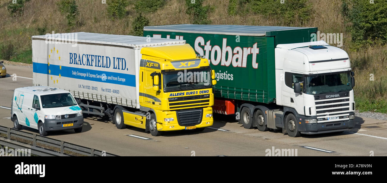 M25 motorway foreign articulated lorry and van overtaking Eddie Stobart ...