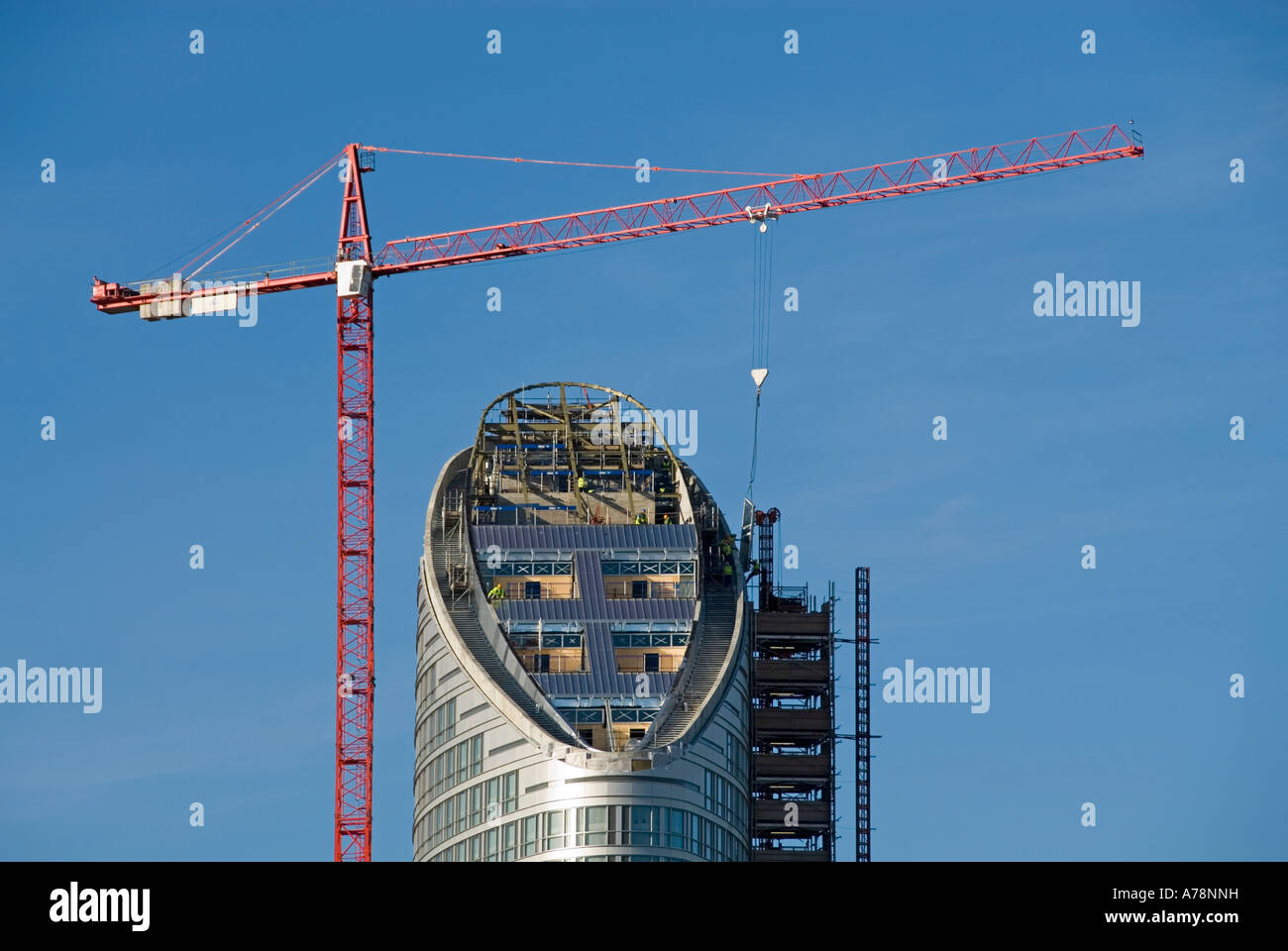 Tower crane riverside skyscraper apartment block building construction ...
