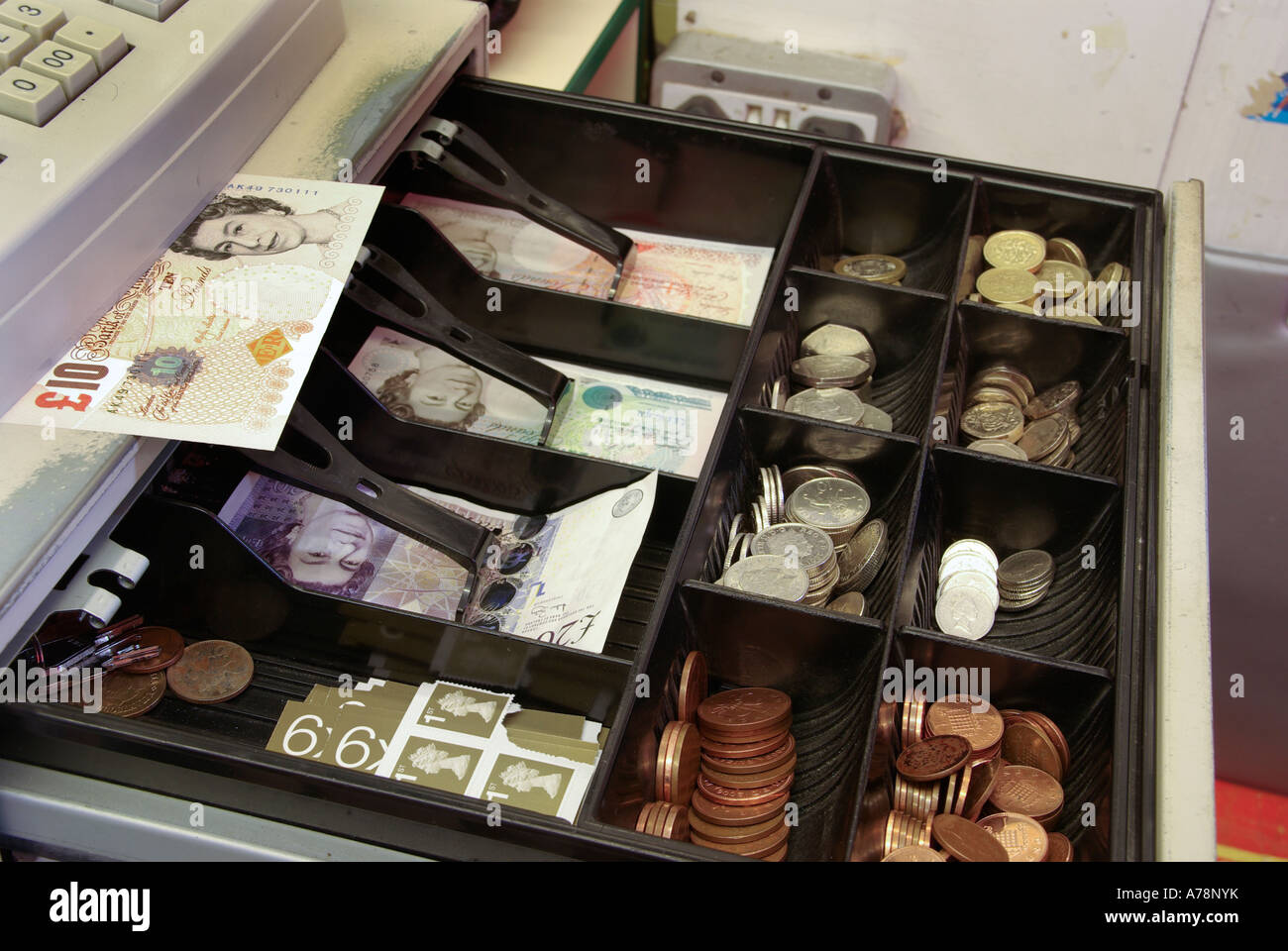 Open shop till showing £10 note on shelf includes new £20 note & other ...