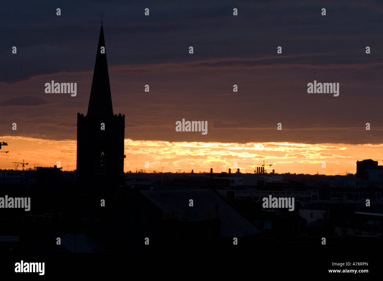 Sunset in Dublin city behind a cityscape skyline Stock Photo - Alamy