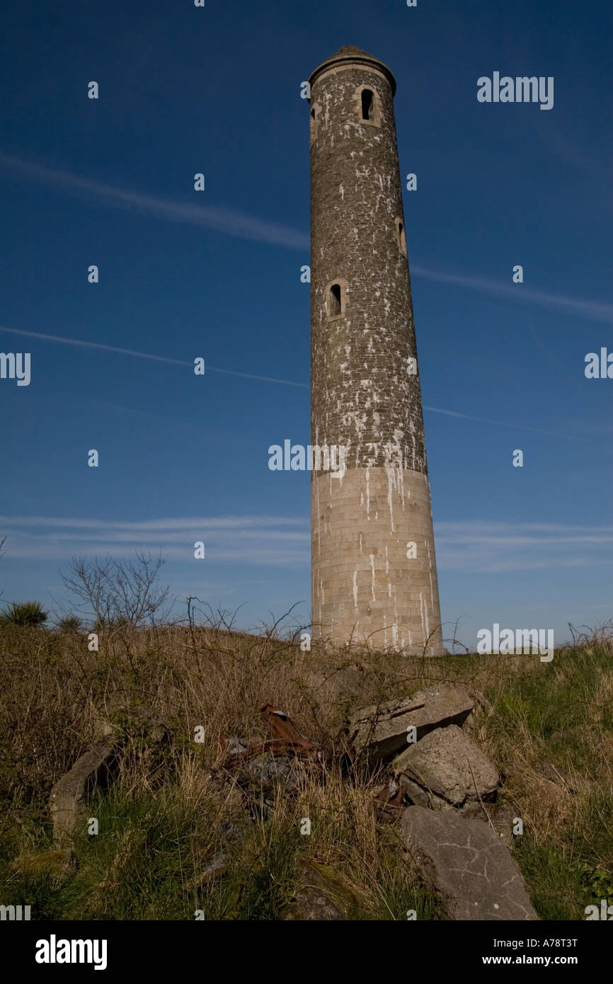 Celtic irish round tower near the sea outside dublin Stock Photo - Alamy