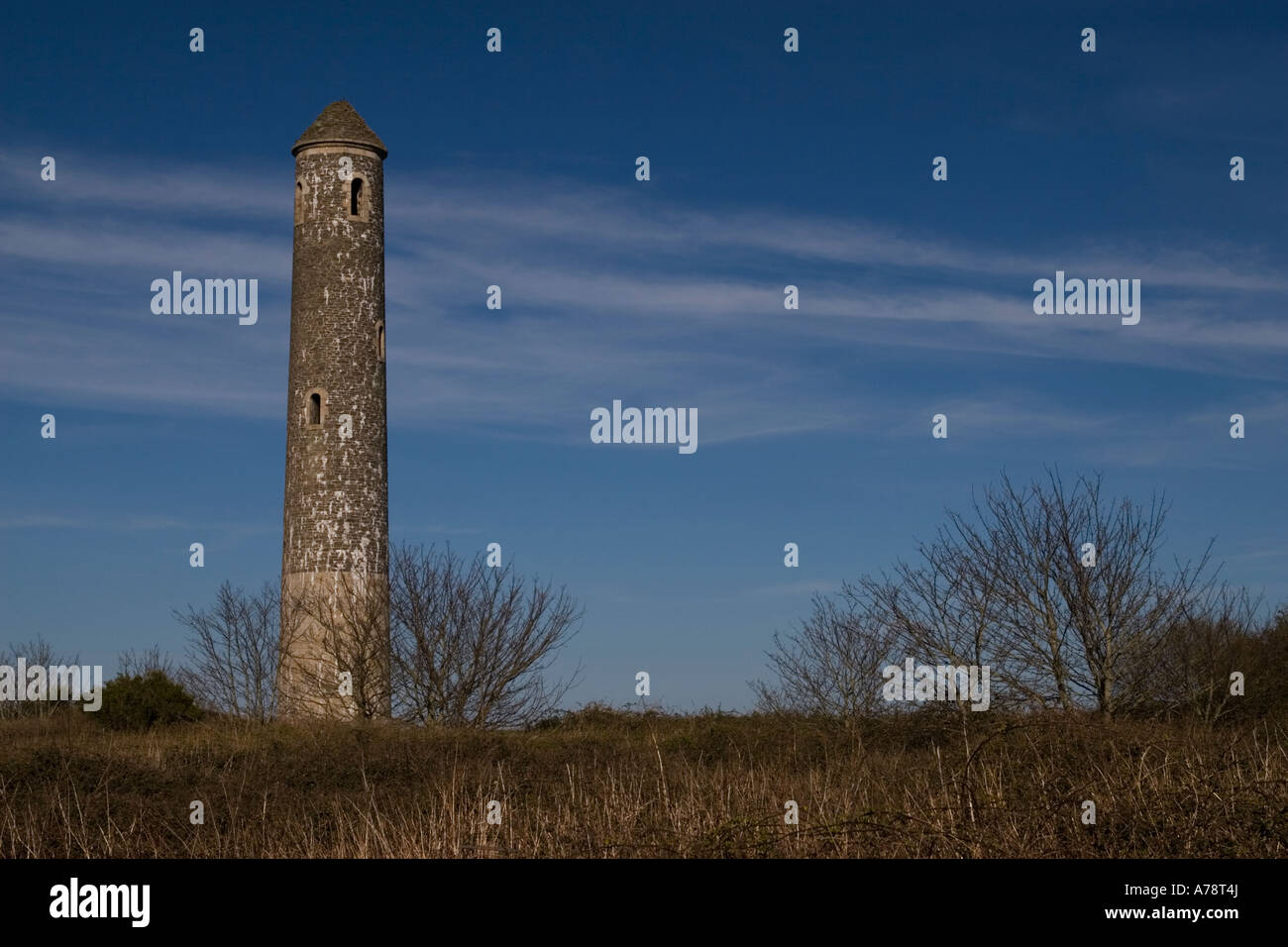 Celtic irish round tower near the sea outside dublin Stock Photo - Alamy