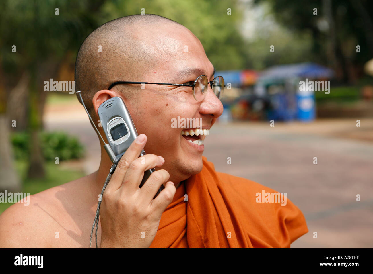 A laughing monk and his cell phone (Yangon, Burma) (Myanmar Stock Photo ...
