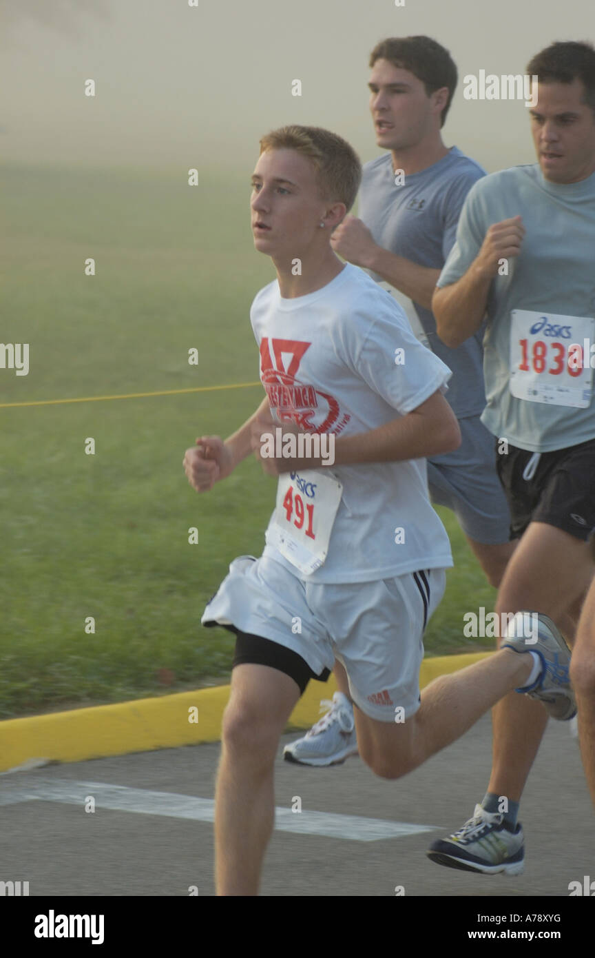 Teenage boy leading 5K race Stock Photo - Alamy