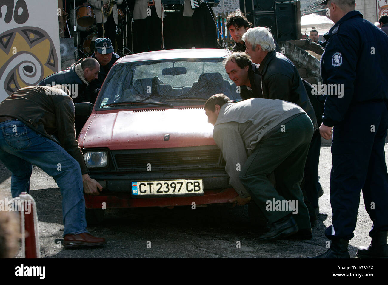 people moving car by hands Stock Photo - Alamy