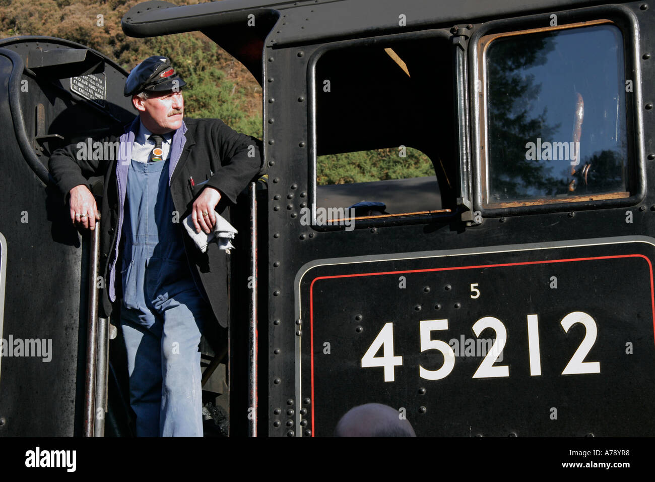 An engine driver at Goathland station, North York Moors Railway, North ...