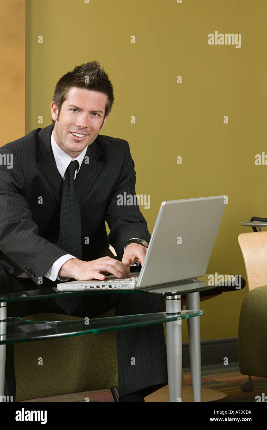 Businessman using laptop Stock Photo - Alamy