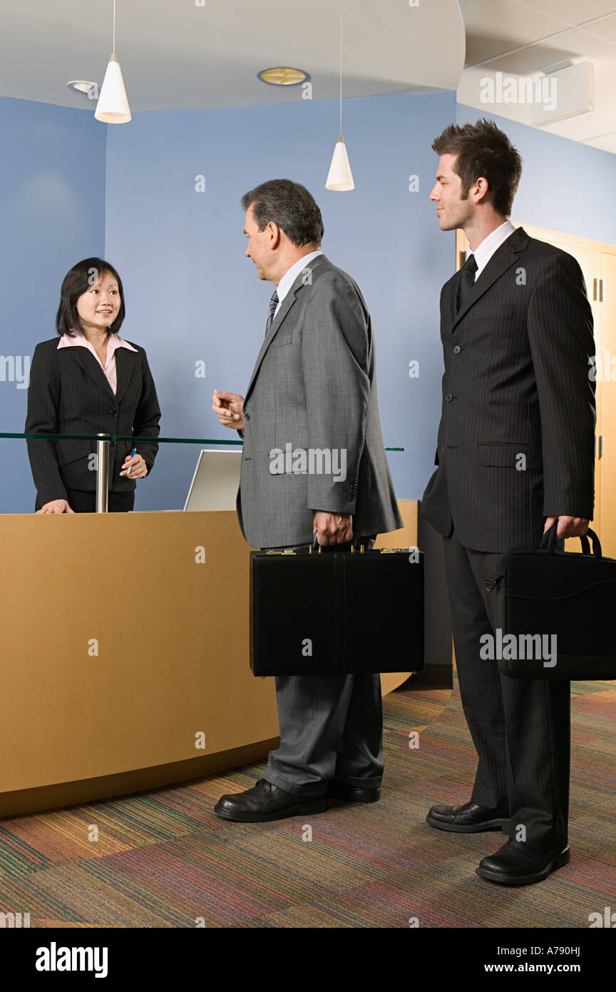 Asian male reception desk hi-res stock photography and images - Alamy