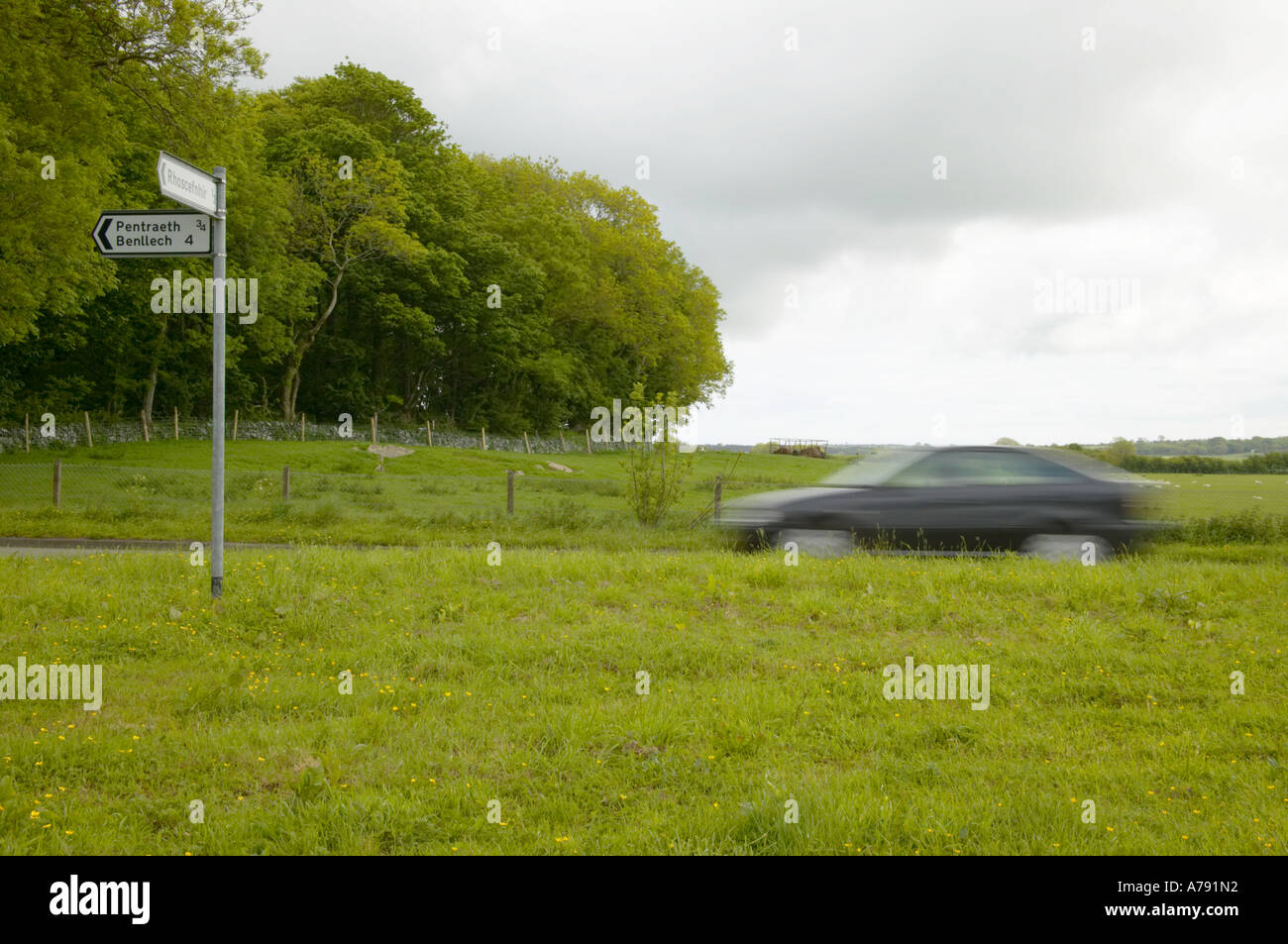 Car travelling at speed along a road in Wales Stock Photo - Alamy