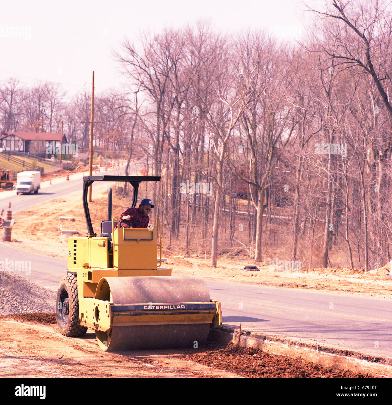 Roller or compactor at a construction site preparing the ground for ...