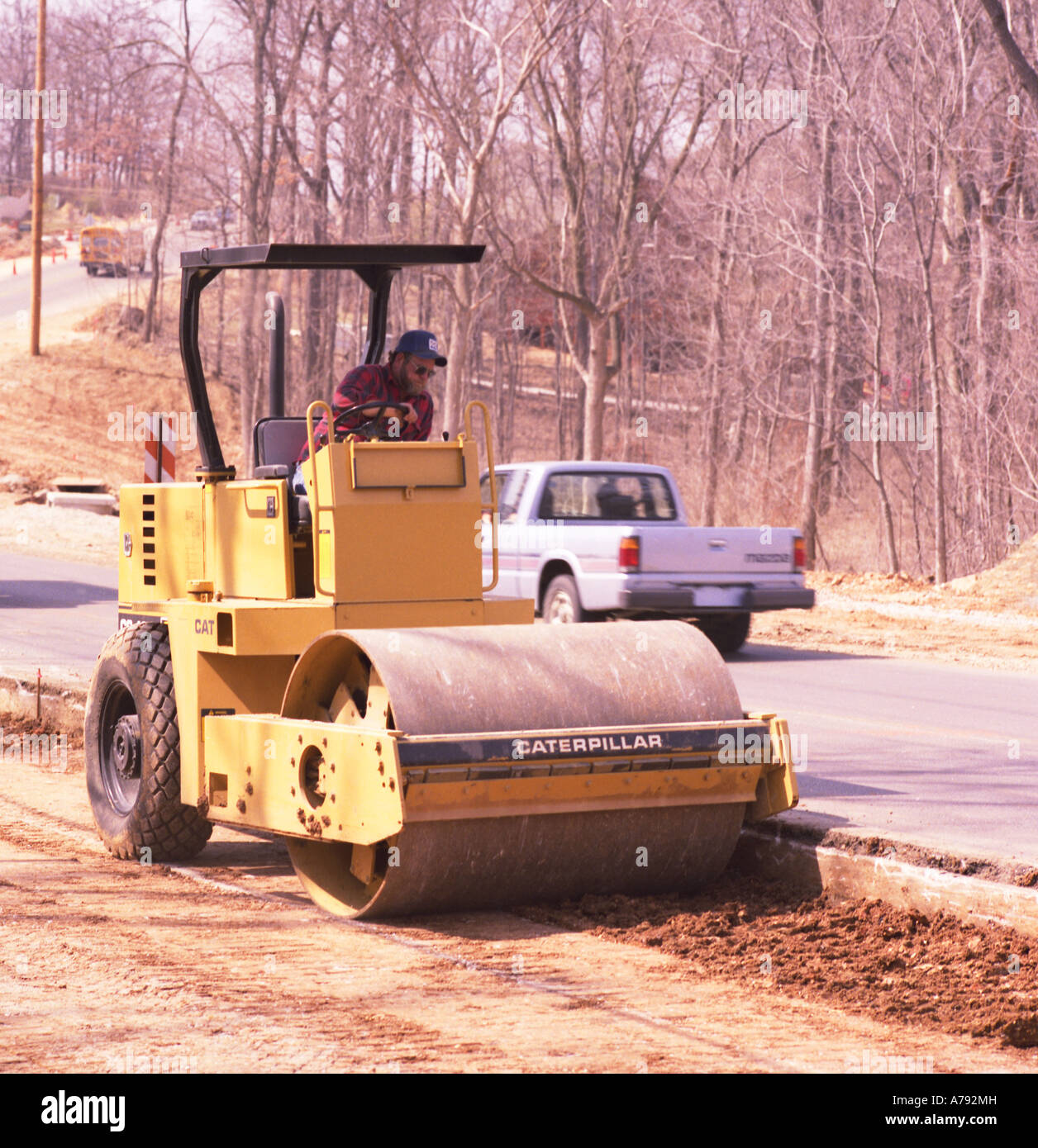 Roller or compactor at a construction site preparing the ground for ...