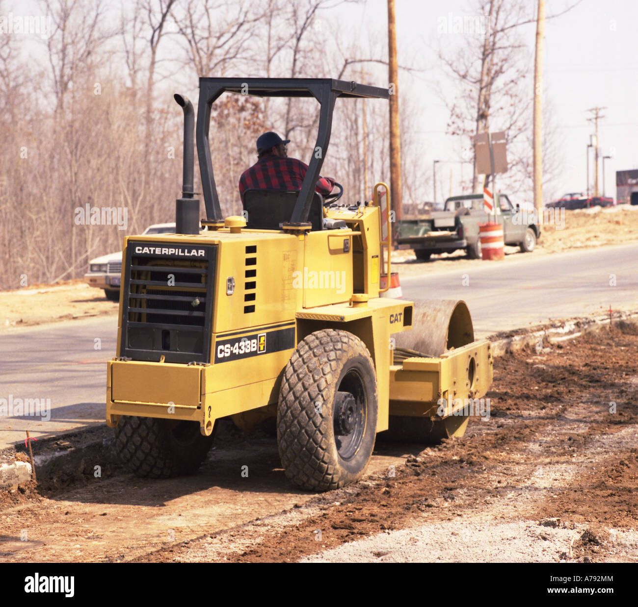 Roller or compactor at a construction site preparing the ground for ...