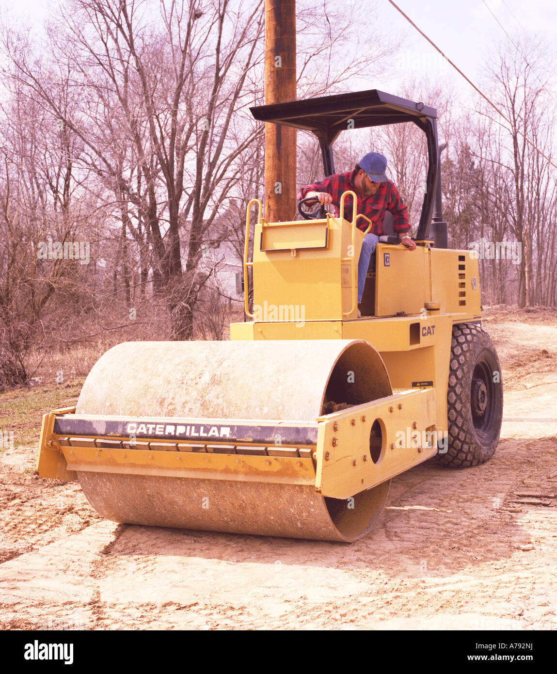 Roller or compactor at a construction site preparing the ground for ...