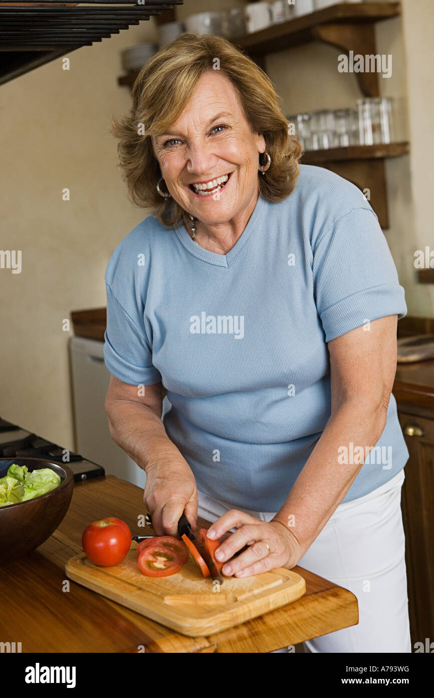 Woman preparing a salad Stock Photo - Alamy
