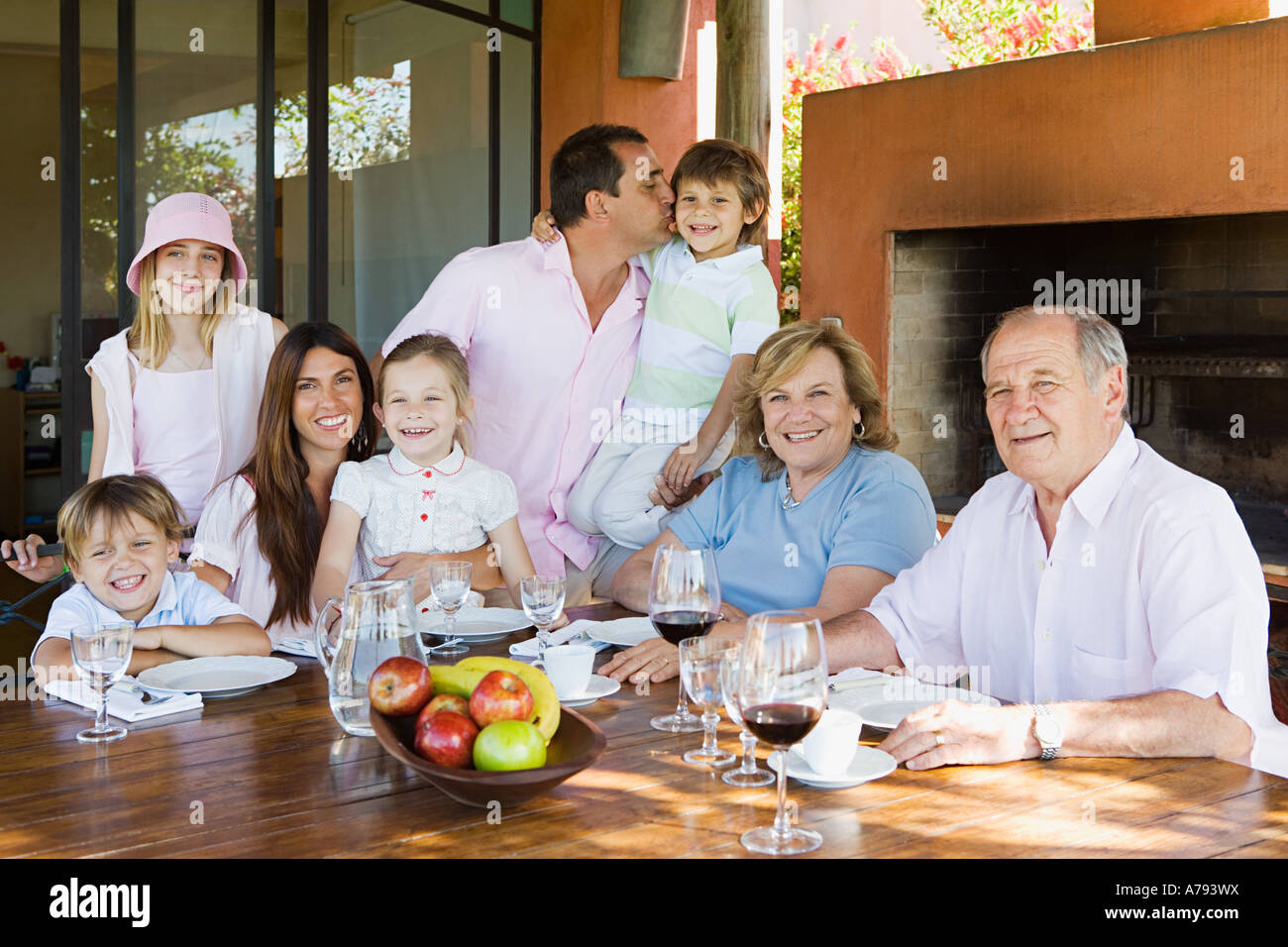 Three generation family at dining table Stock Photo - Alamy