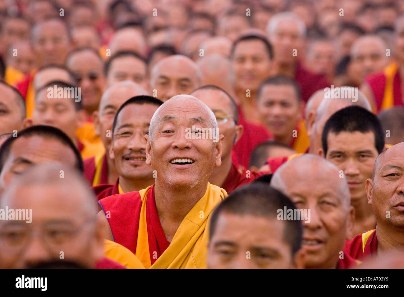 Happy monks smiling at the Dalai Lama's teachings at the Kalachakra ...