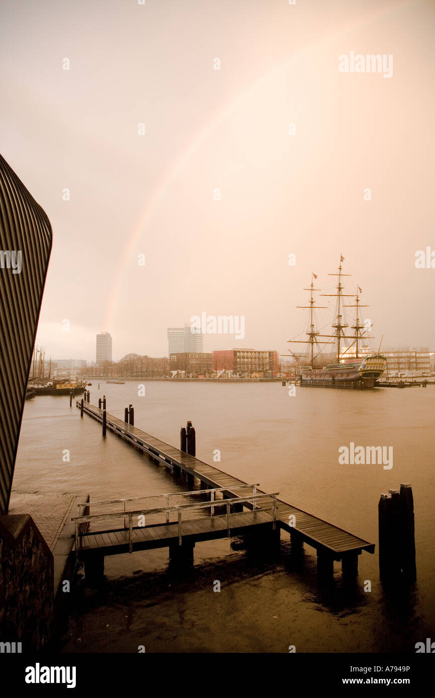 amsterdam bay ships in port in amsterdam with rainbow Stock Photo - Alamy