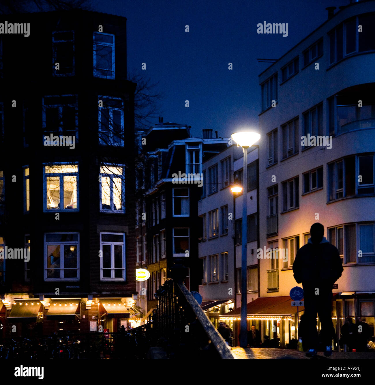 traditional amsterdam architecture with canal bridge boats and bicycle ...