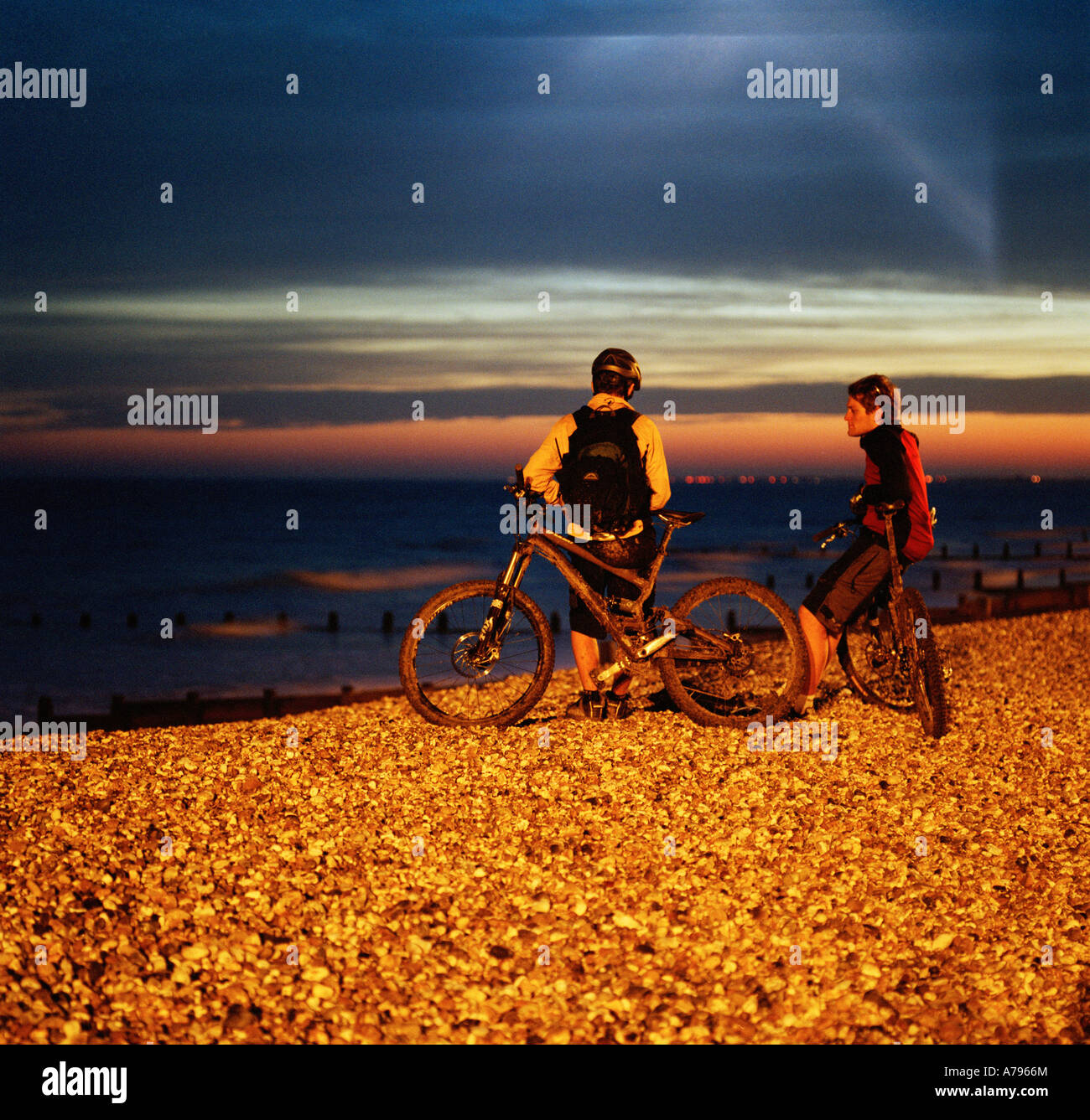Mountain Bikers on a beach Stock Photo - Alamy