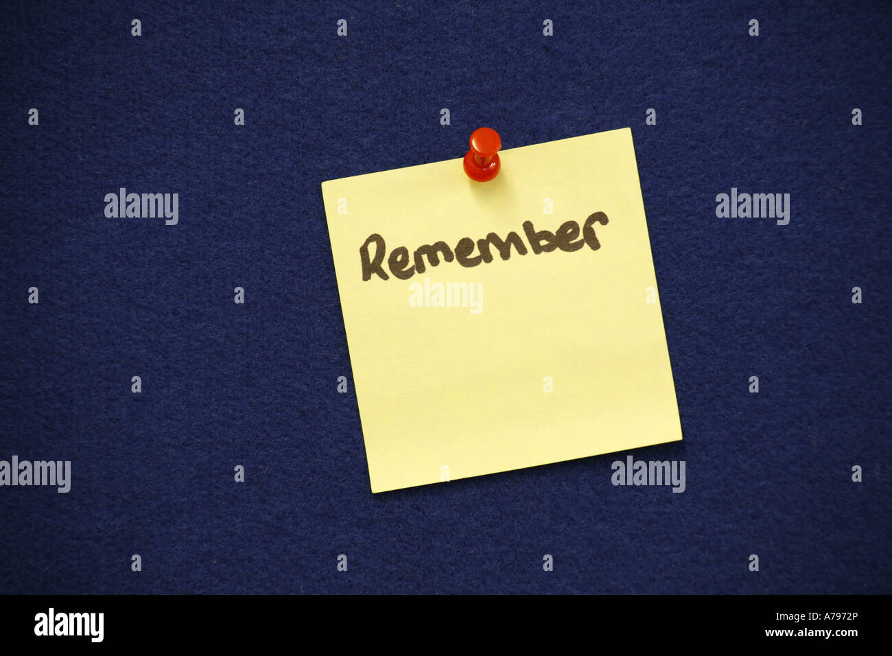 Yellow Post It Note on a Blue Background Stock Photo - Alamy