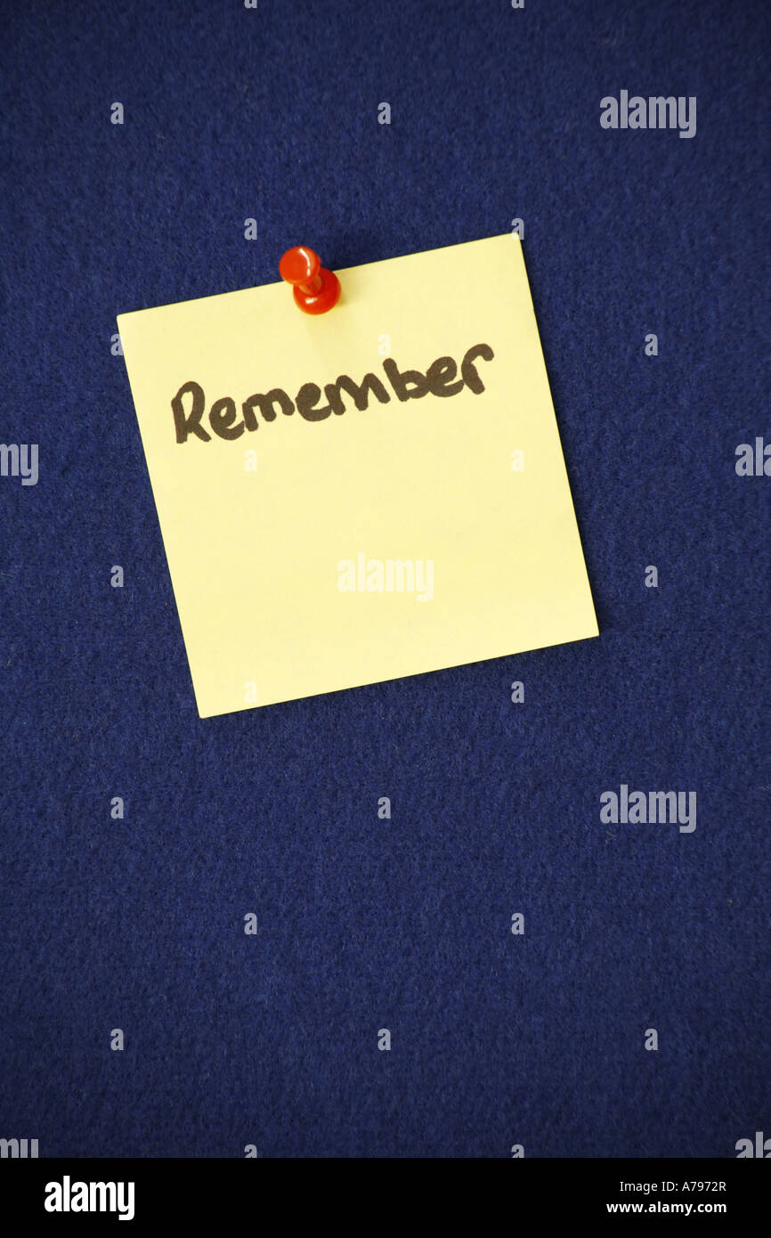 Yellow Post It Note on a Blue Background Stock Photo - Alamy