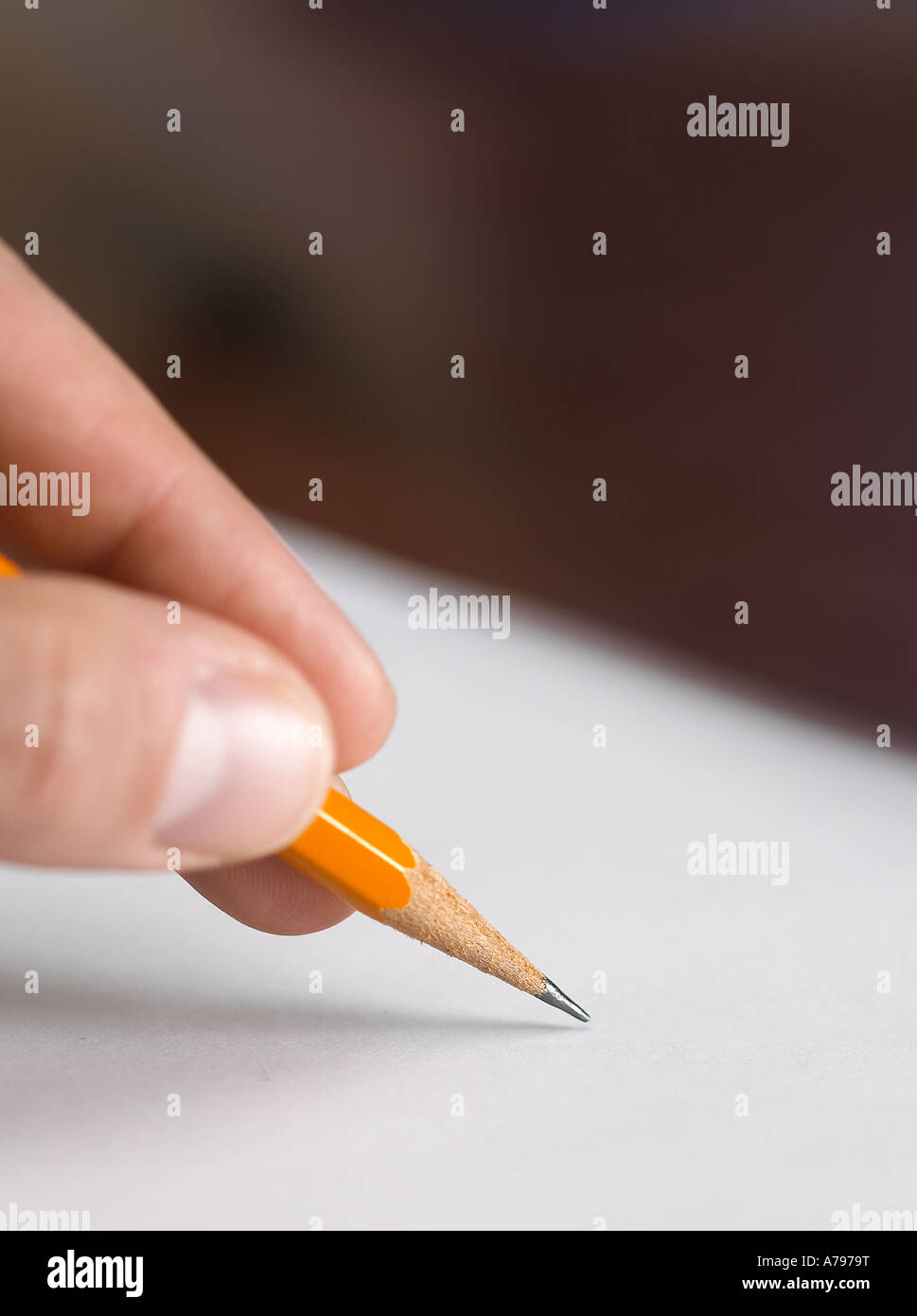 Hand holding pencil hi-res stock photography and images - Alamy