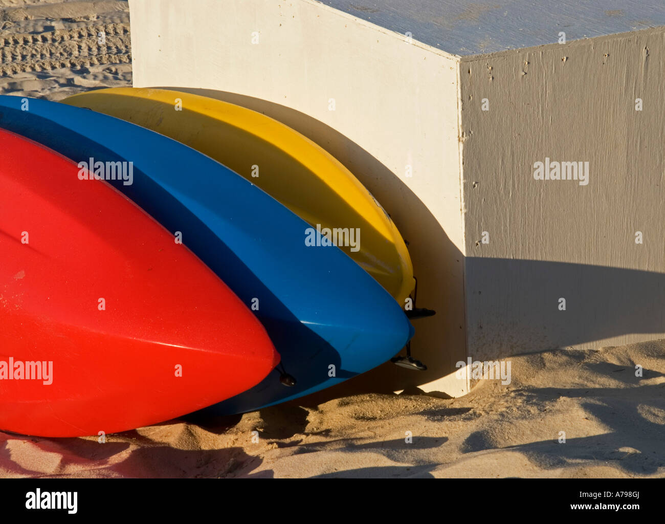 Colorful ocean kayaks on beach Stock Photo - Alamy