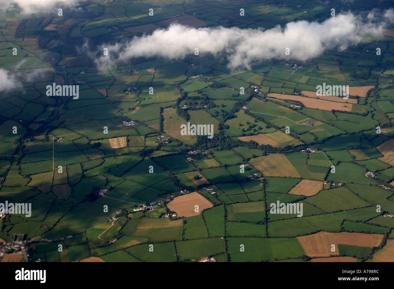 Aerial view of landscape fields farms and hedgerows from the air over ...