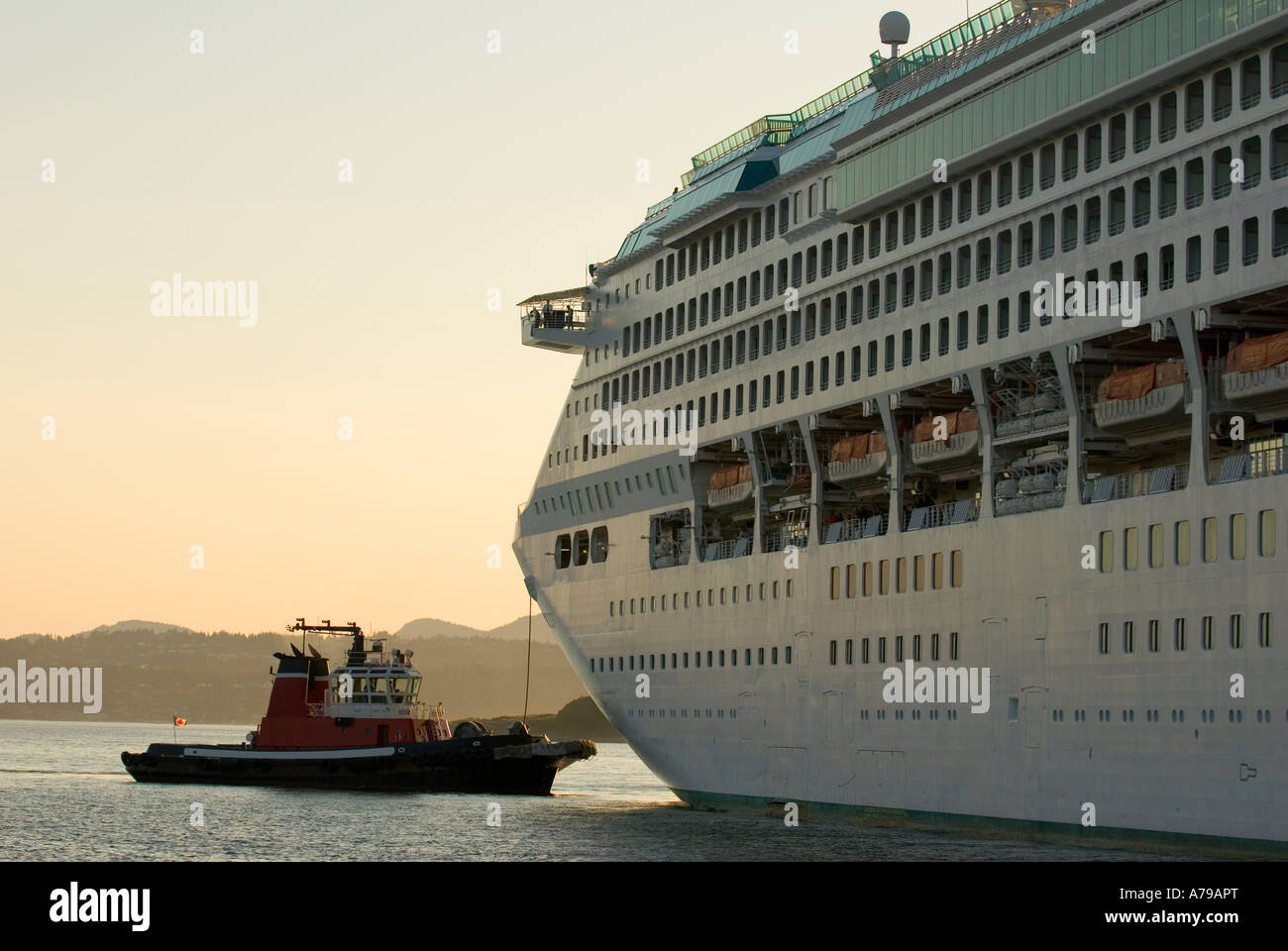 A tugboat docks a large Cruise Ship in the Port of Victoria Victoria BC ...