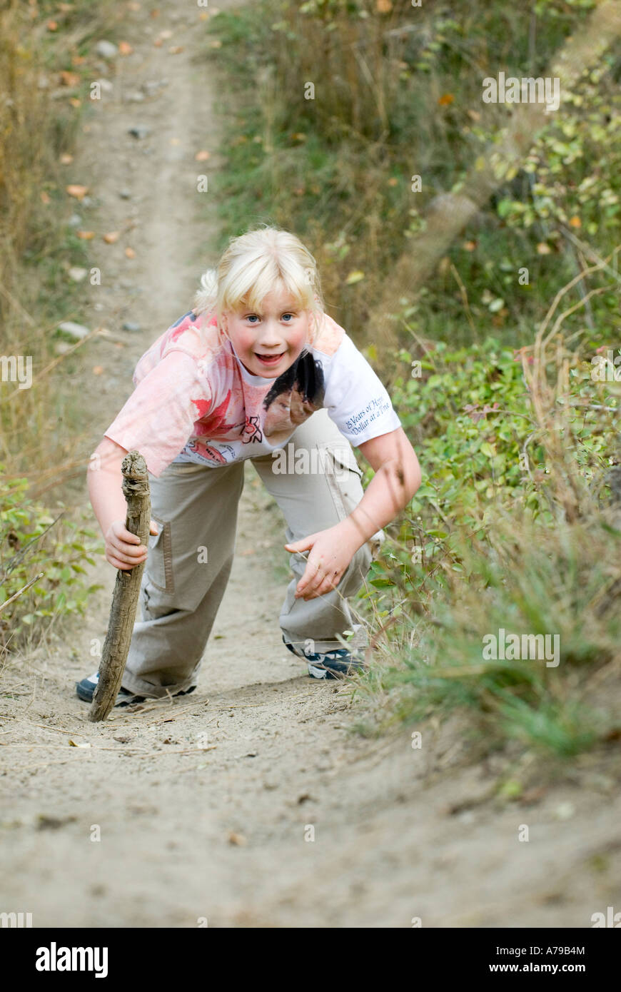 A young girl climbing up a steep path on the River Trail in Williams ...