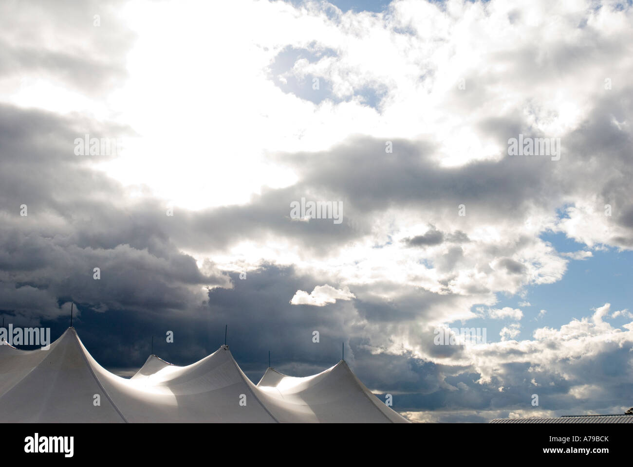 The top of a circus tent reaches skyward while a storm approaches Stock ...