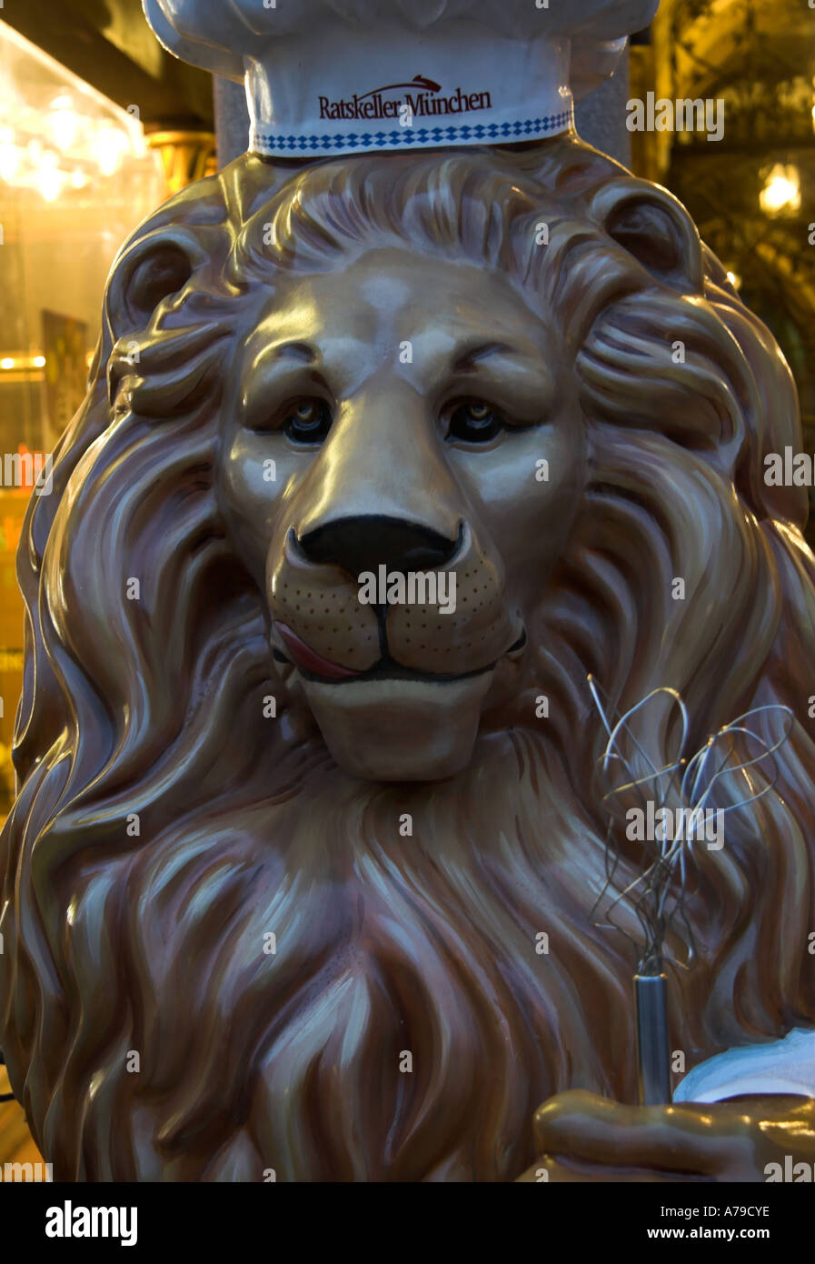 Painted sculpture of Bavarian Lion outside a shop in old town in Munich ...