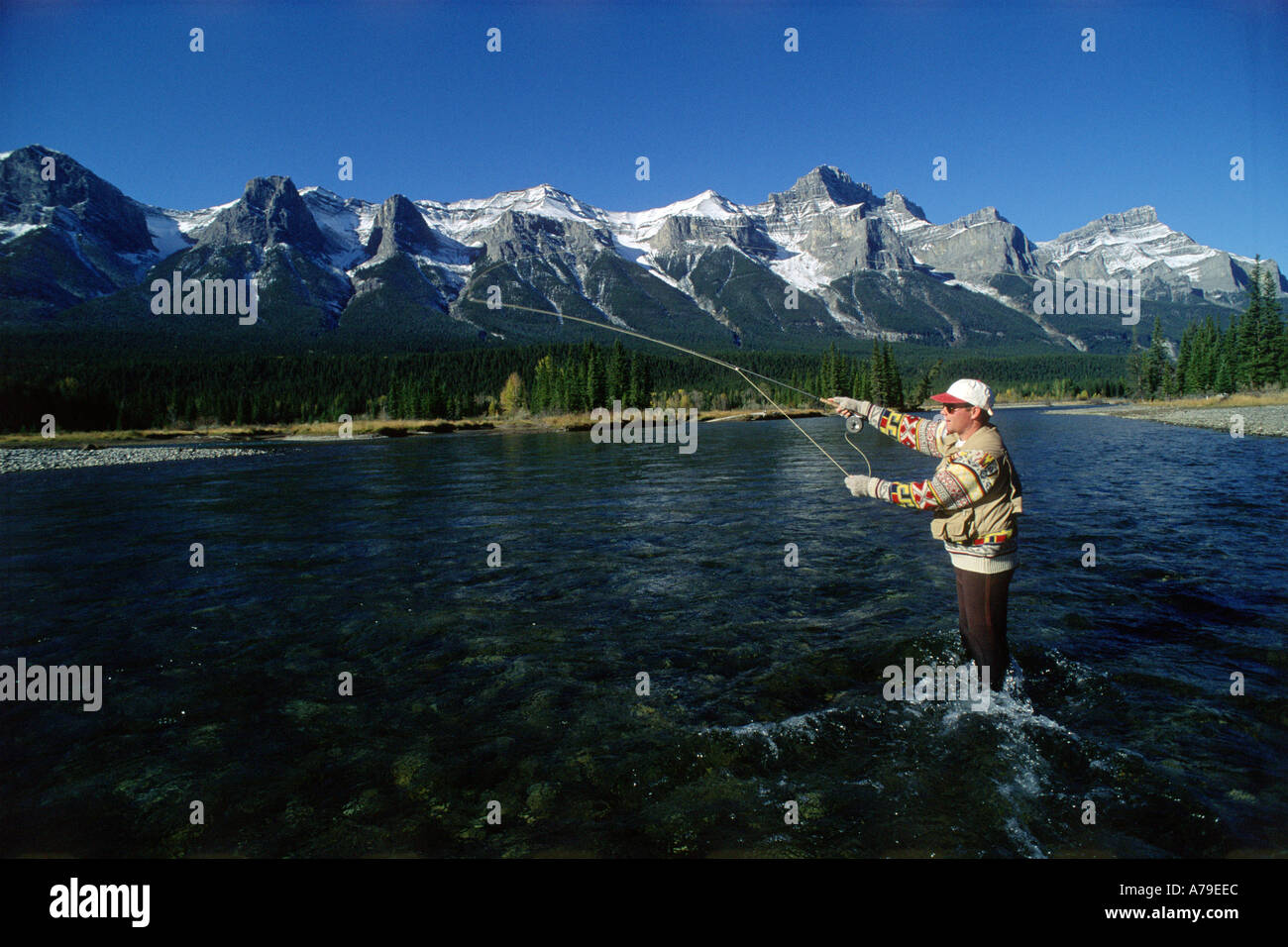 Fly fishing in Canmore Alberta with Mount Rundle in background Stock ...