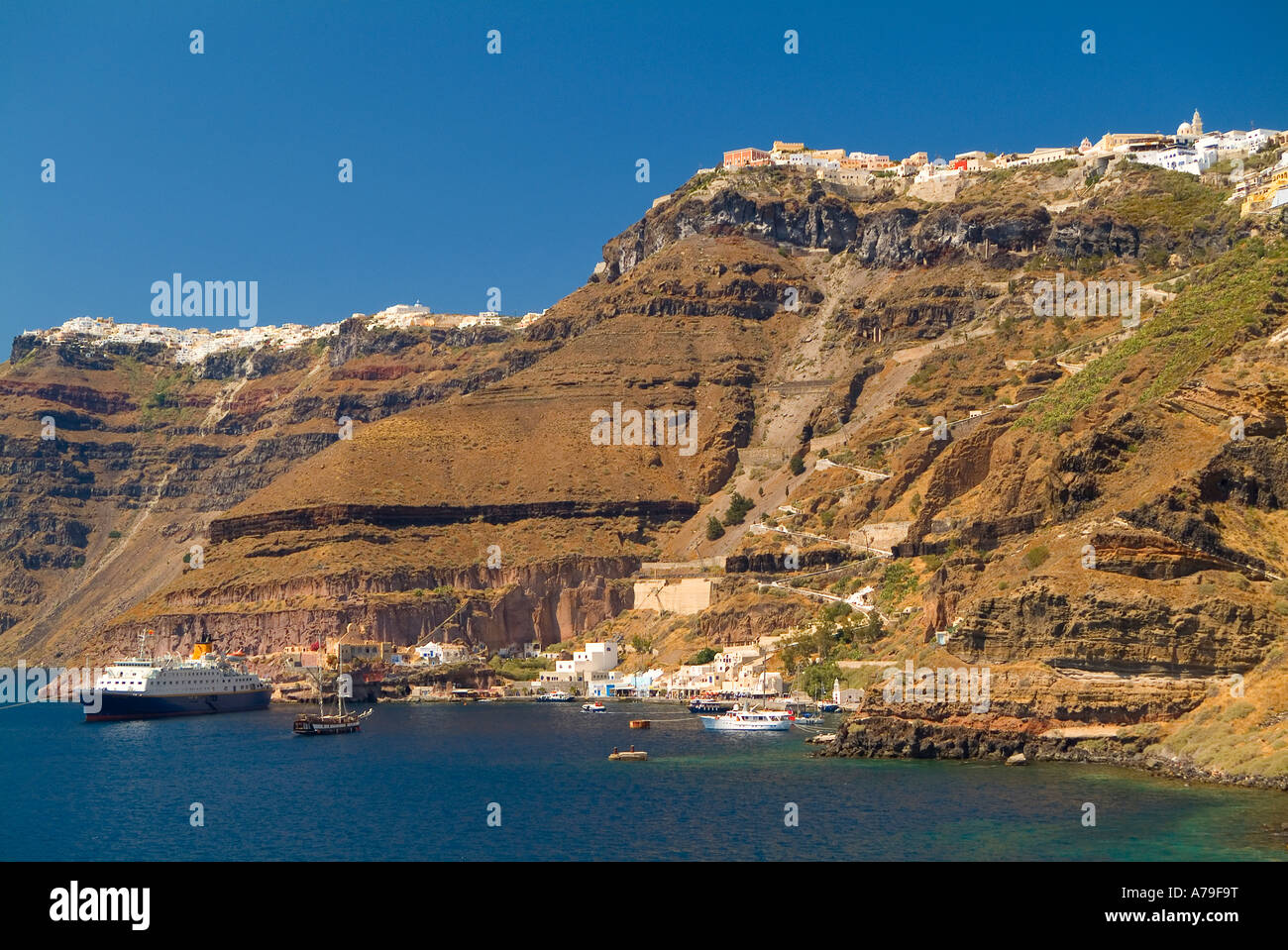 The port of Scala and the village of Thira, Santorini, Greece Stock ...
