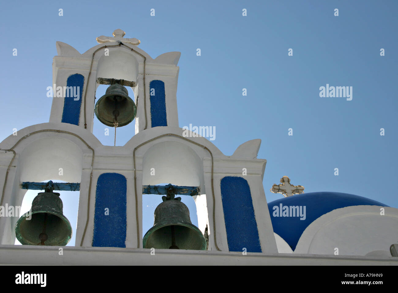 Three Bells: Three bells in a church tower next to the dome and cross ...