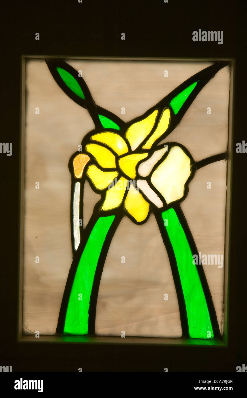 a daffodil design in a modern stained glass window Stock Photo - Alamy