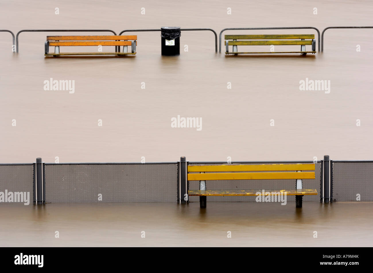 Benches at bus stop flooded with water Stock Photo - Alamy