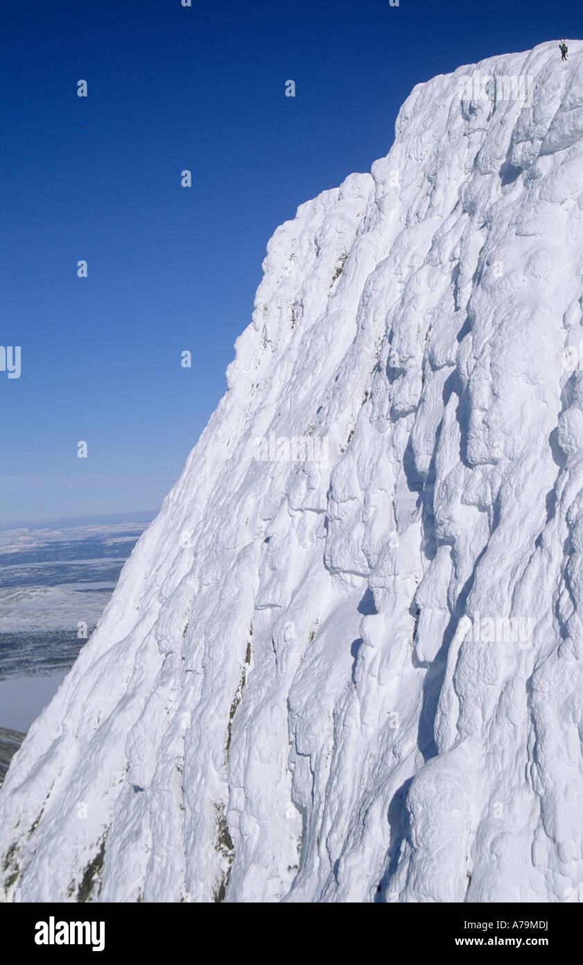Climber approaching summit Stock Photo - Alamy