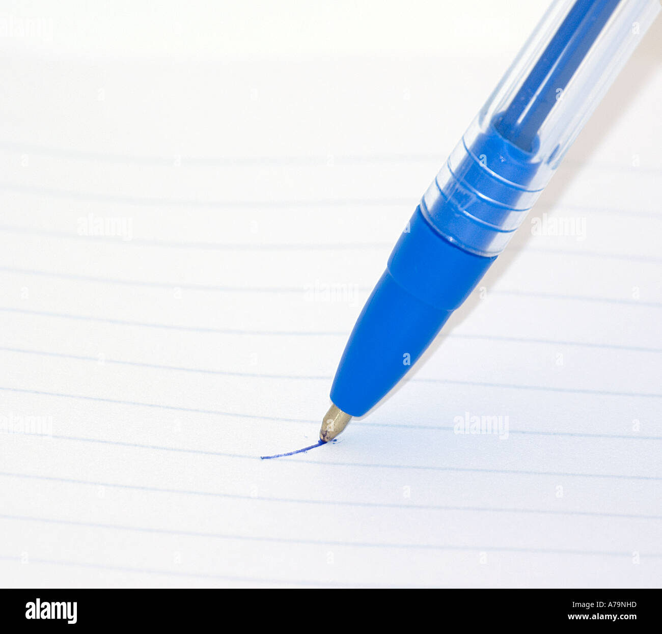 Pen on lined paper Stock Photo - Alamy