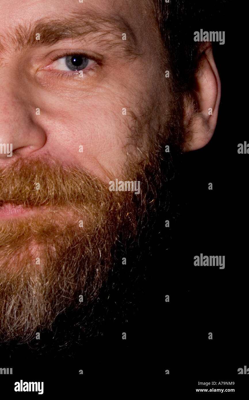 Close up of rough looking man with beard Stock Photo - Alamy