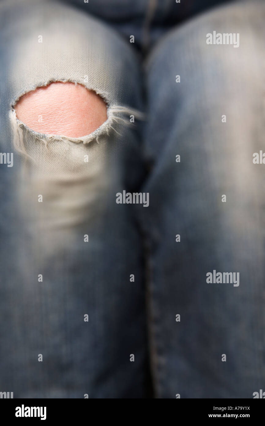 Woman in torn jeans hi-res stock photography and images - Alamy