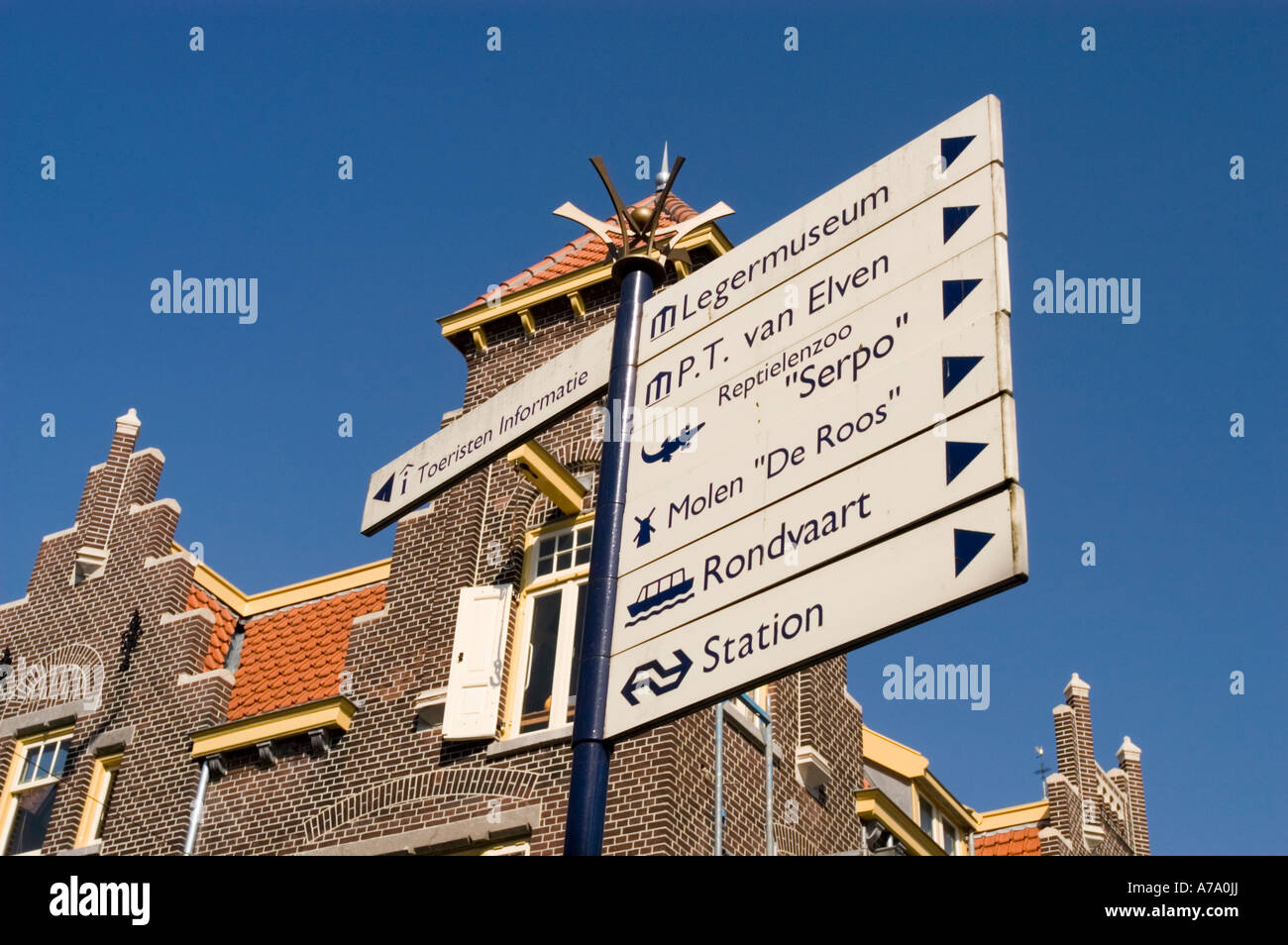 Tourist Information sign and heritage building and blue sky Delft South ...