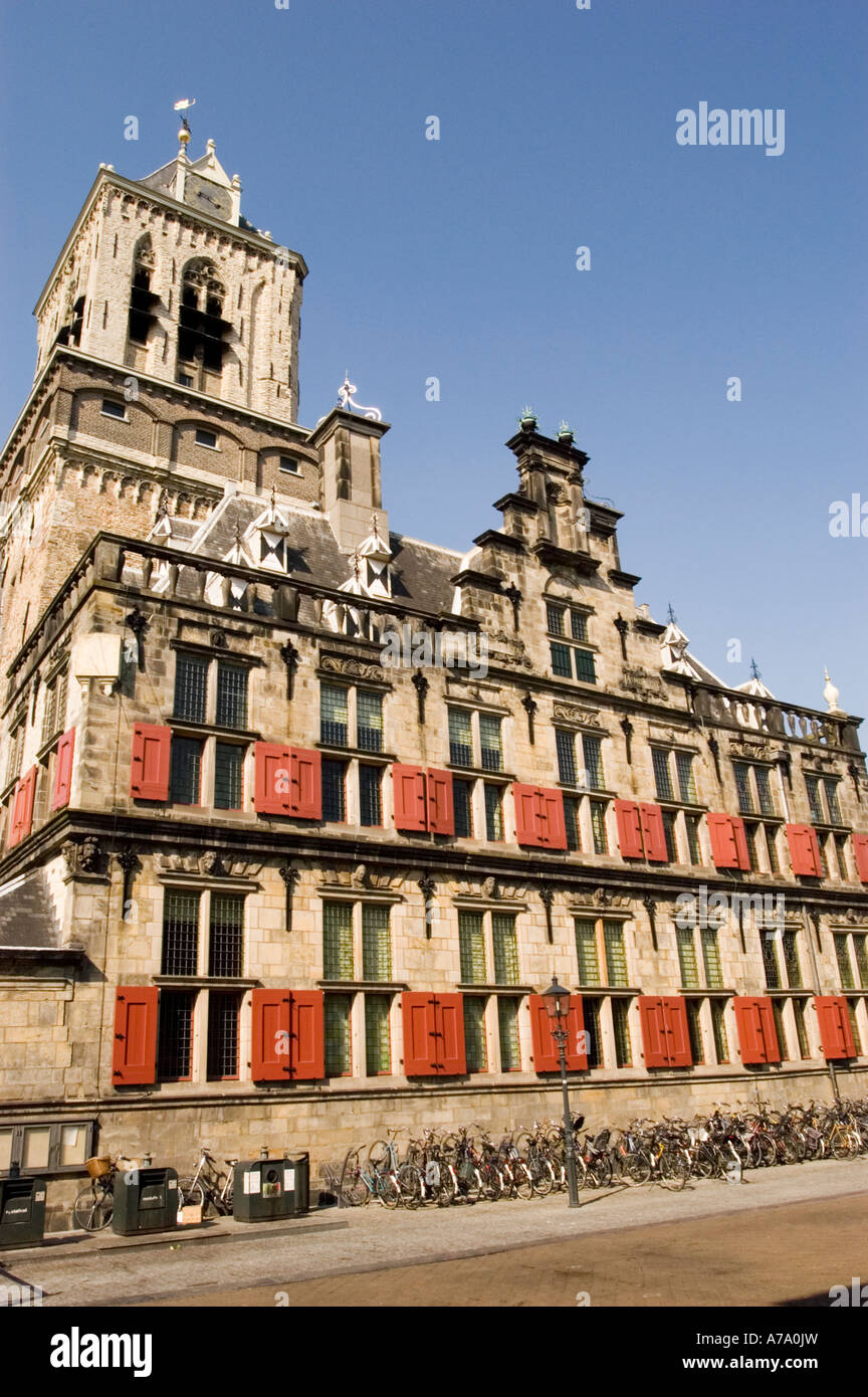 Delft Stadhuis or Townhall with red shutter windows and blue sky ...