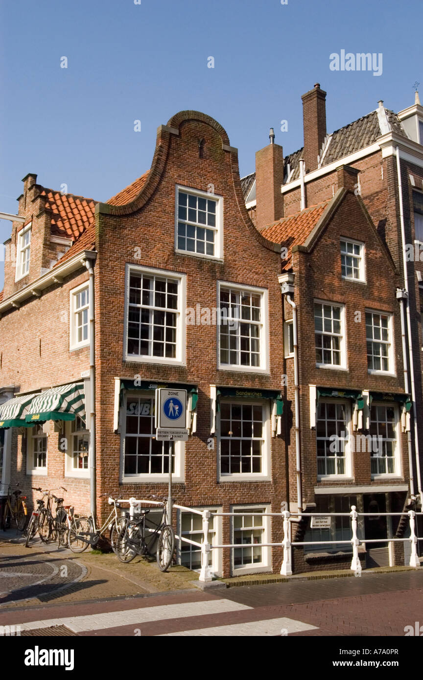Two heritage apartment houses on the canal bank near Vermeer house in ...